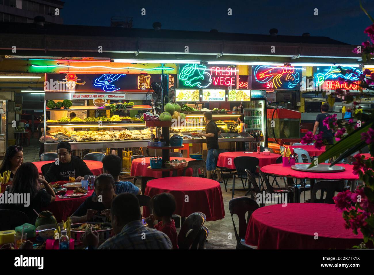 Display of seafood and vegetables at the Kuching Open Air Market. A ...