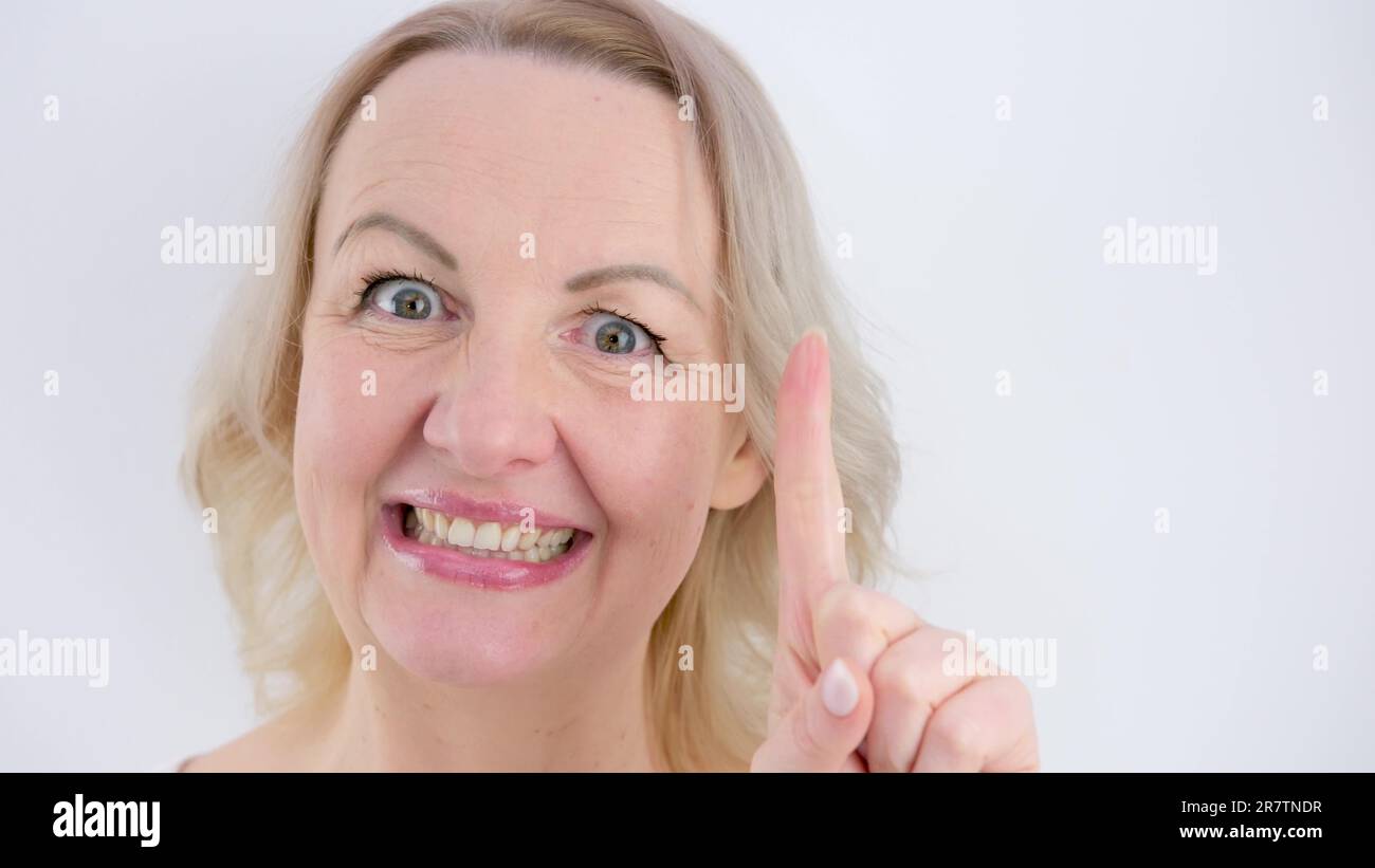 woman spreads her fingers 1 2 3 4 5 on palm of her hand show the score ...