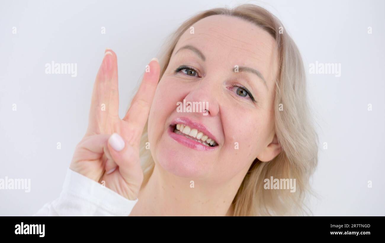 Close up of isolated female hand shows fist fist, then one, two, three ...