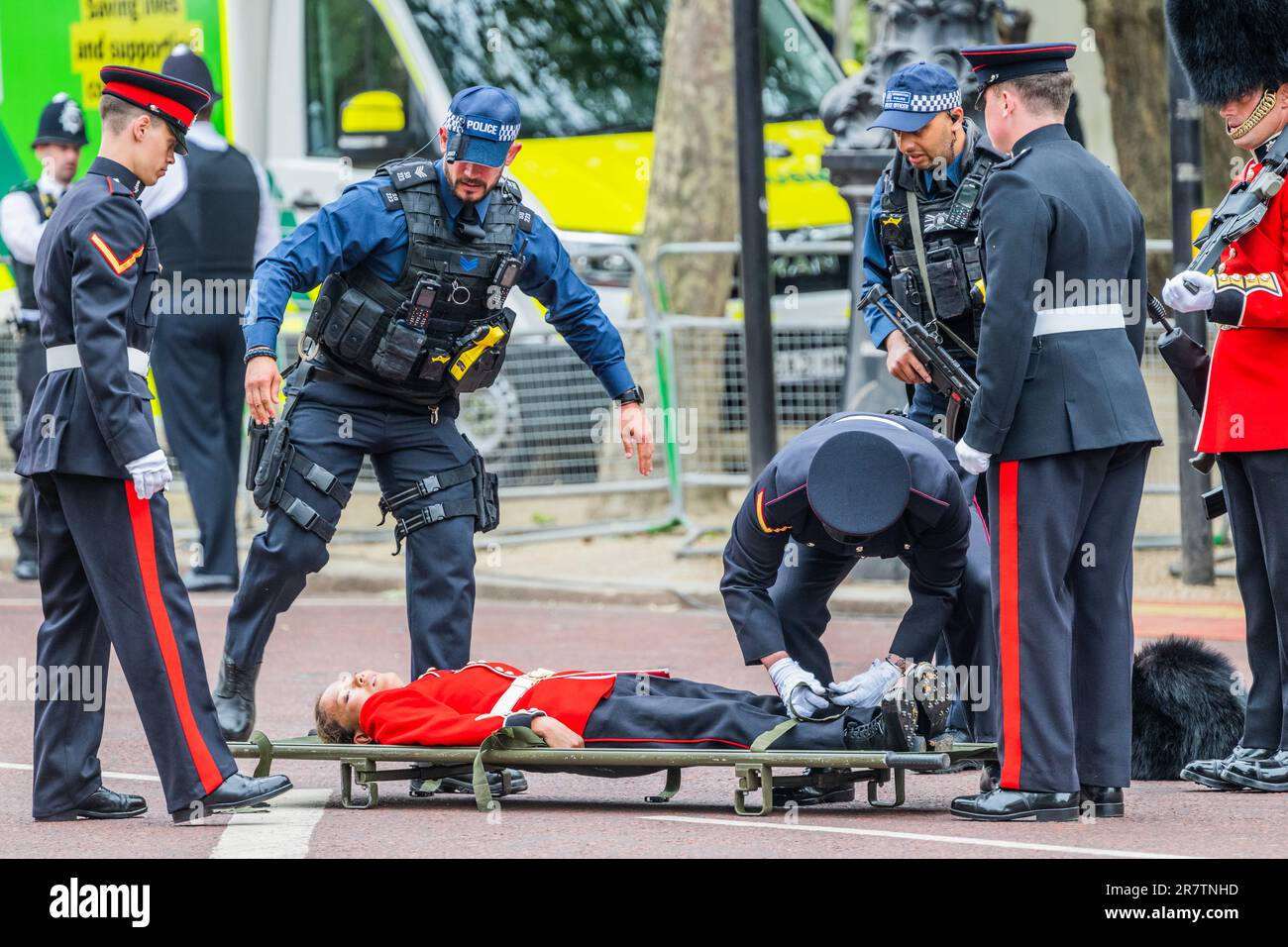 London, UK. 17th June, 2023. A female Guardsman collapses in the ehat ...