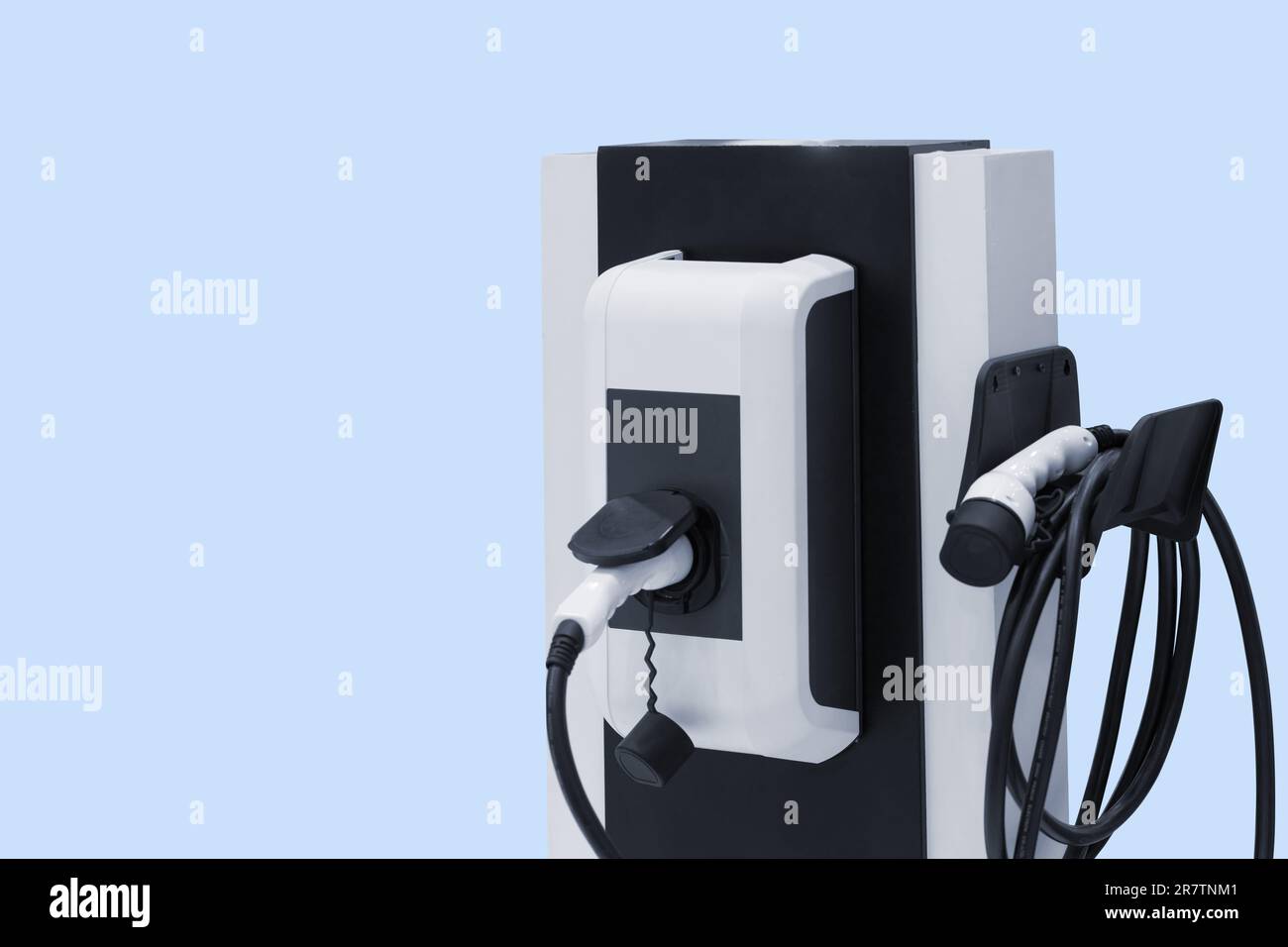 EV Car charger station dock isolated on blue background Stock Photo - Alamy
