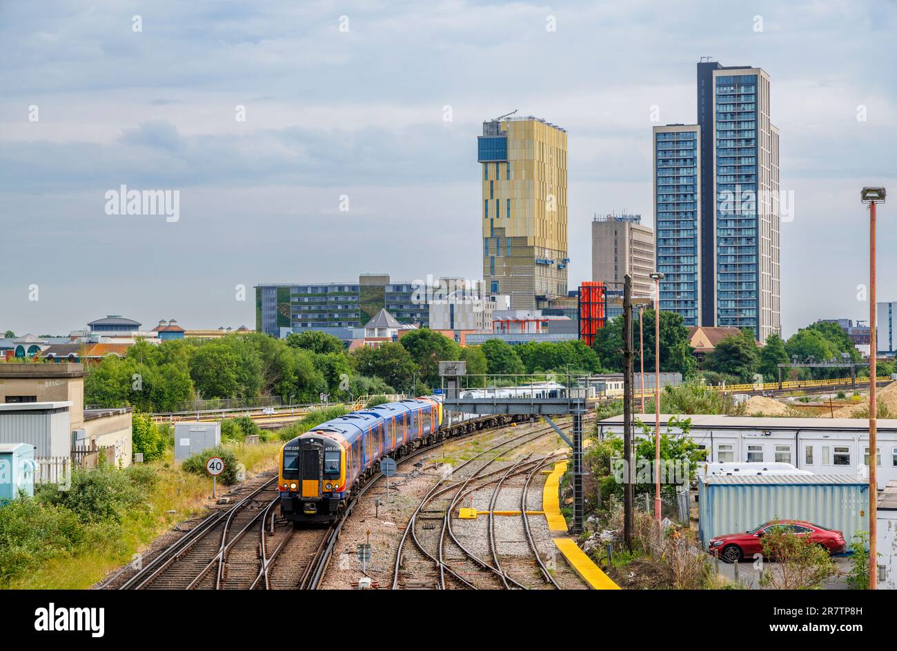 A South Western Railway commuter electric passenger train on tracks ...