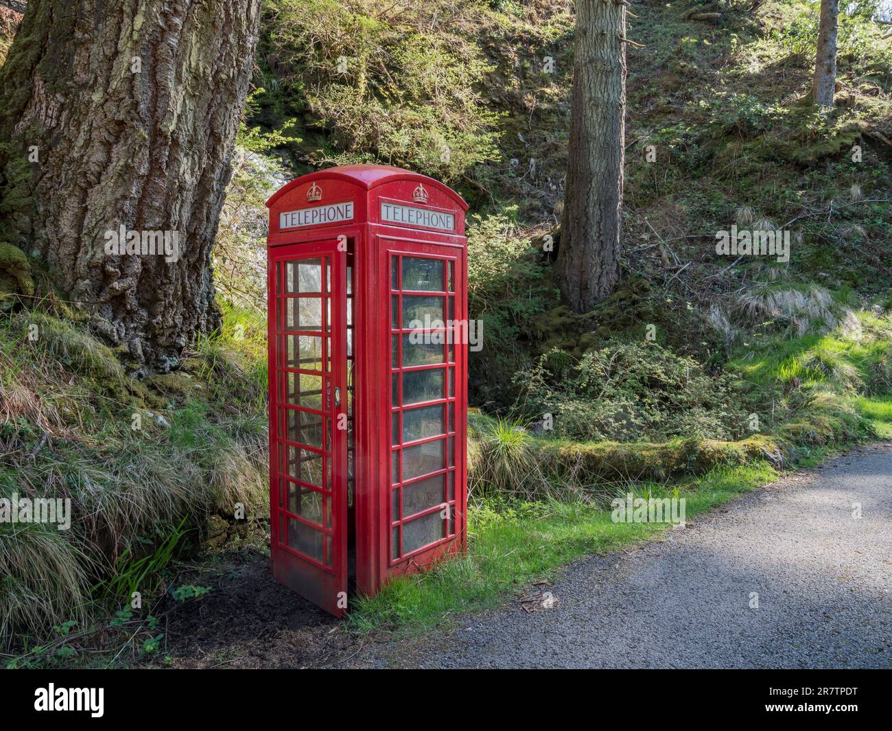 Traditional british telephone booth, lonely placed at the road to ...
