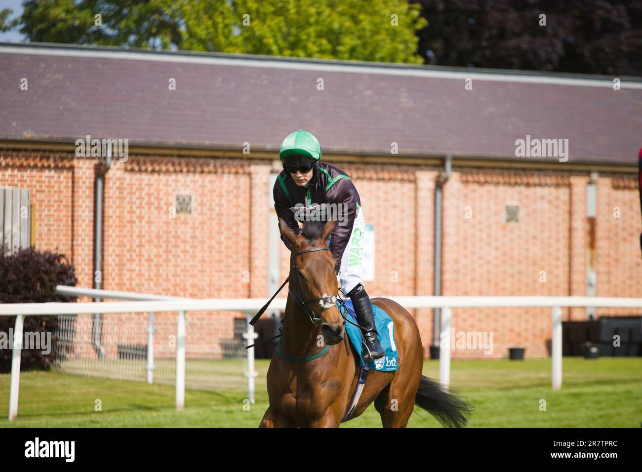 Jockey Jason Hart walking back to the stables after a race at York ...