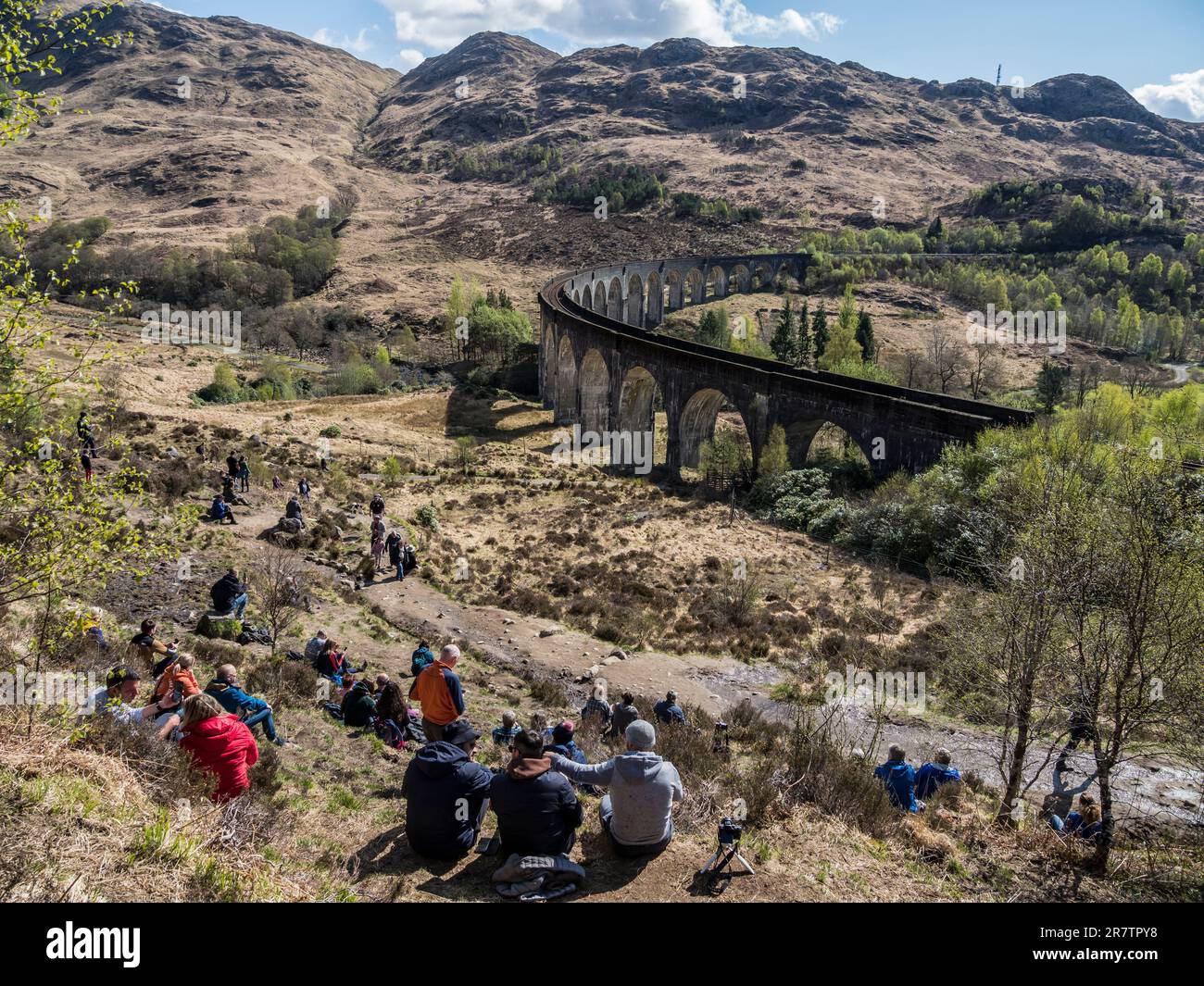 tourists waiting for the jacobite steam train at the Glenfinnan viaduct ...