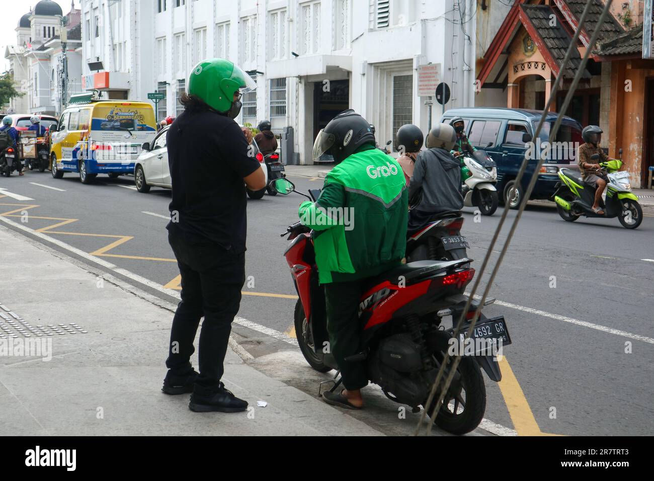 Asian motorcycle taxi man driving isolated over white background Stock ...