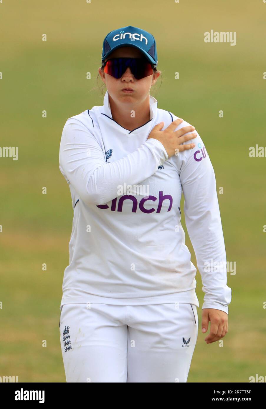 England’s Alice Capsey holds her shoulder as she leaves the field after ...