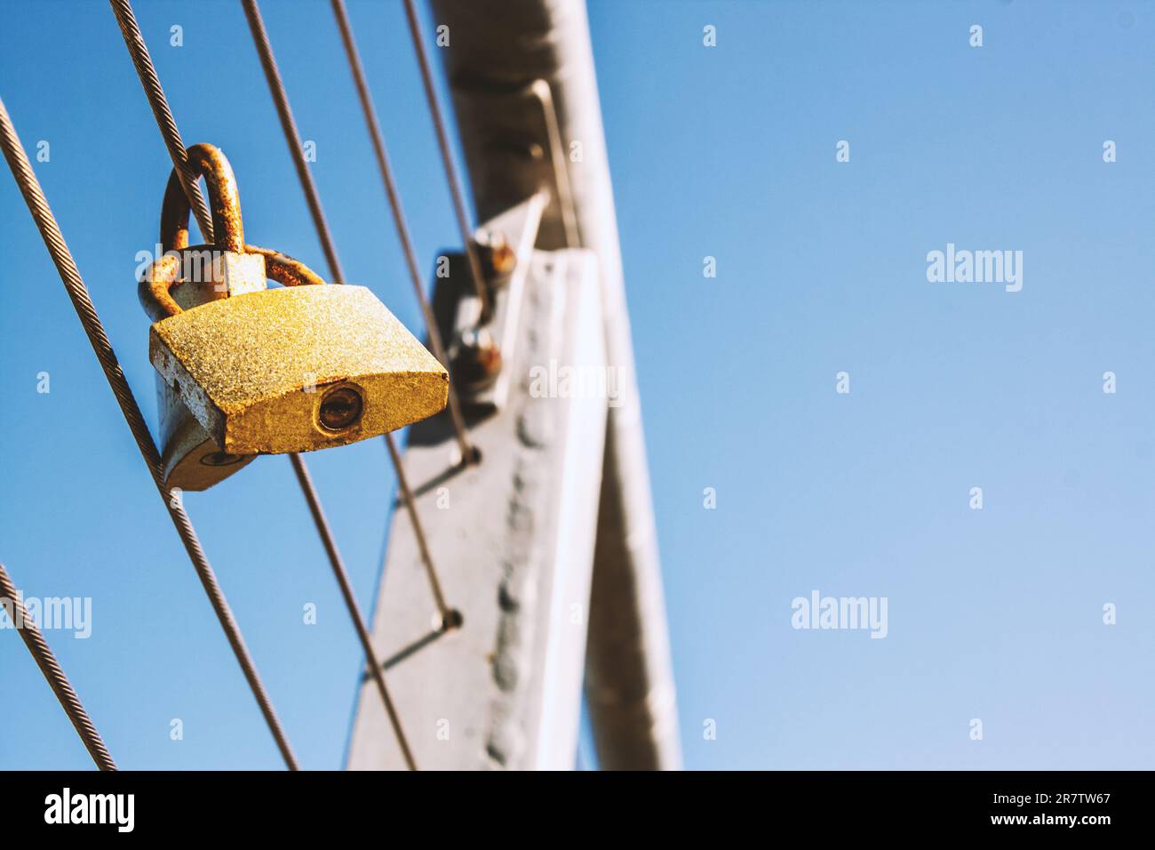 An up close and personal view of two padlocks, securely wrapped around ...