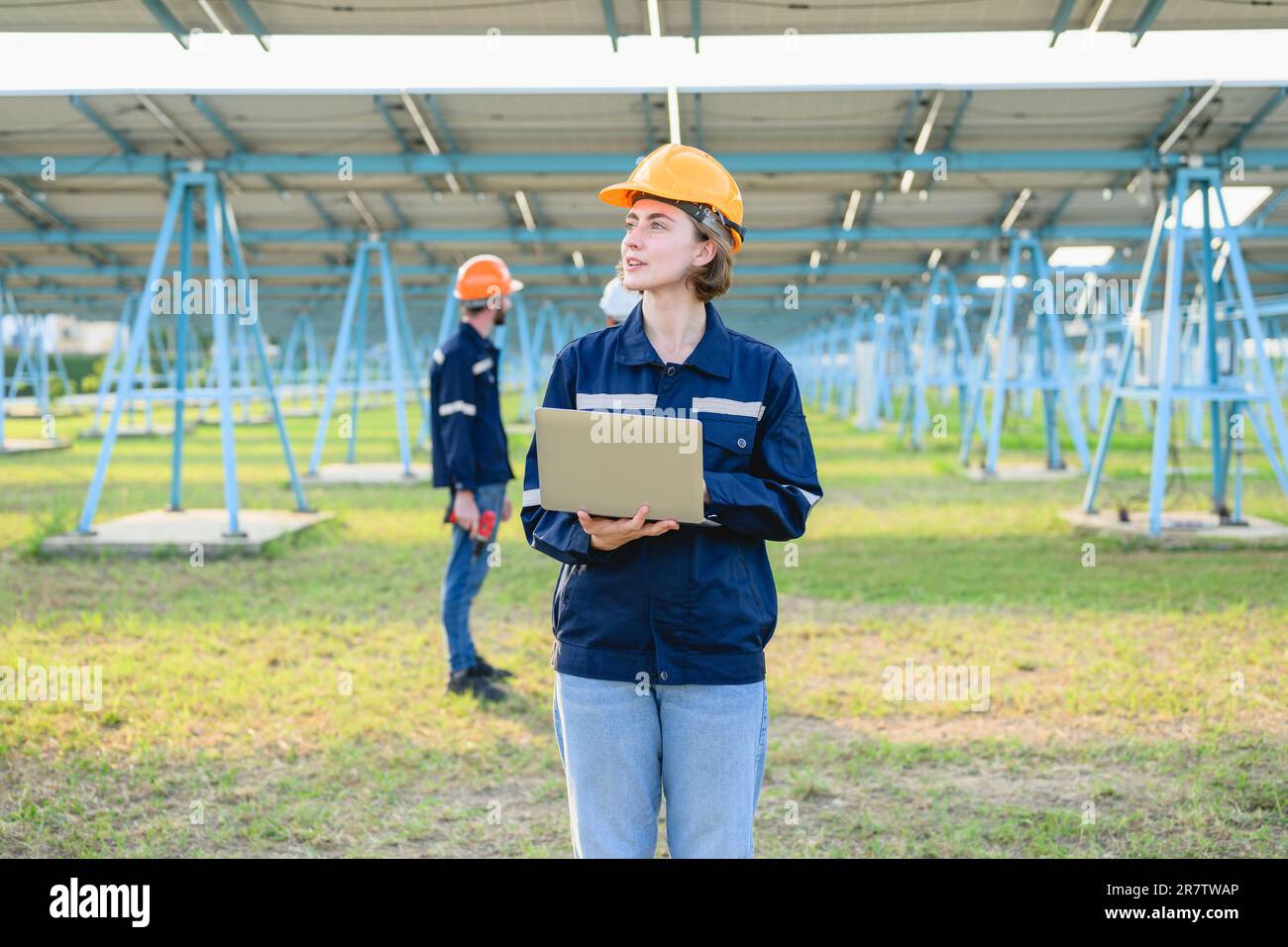 Engineers team working together at solar power station Stock Photo - Alamy