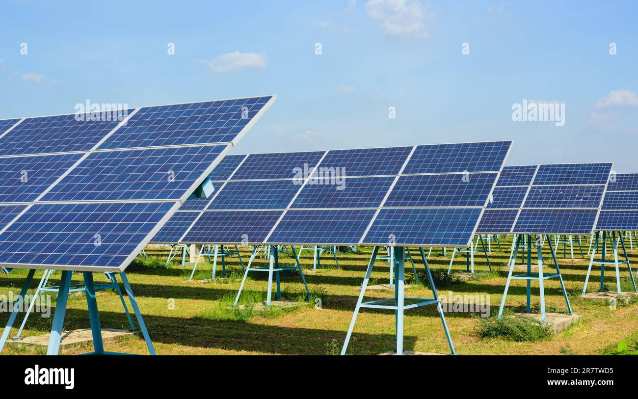 Photovoltaic solar panels with sun at solar cell farm field Stock Photo ...