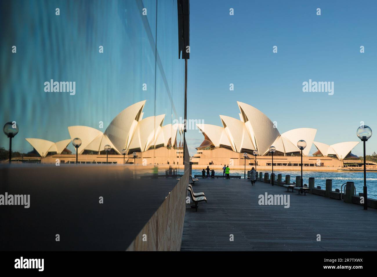 A scenic shot of the iconic Sydney Opera House reflecting off the ...