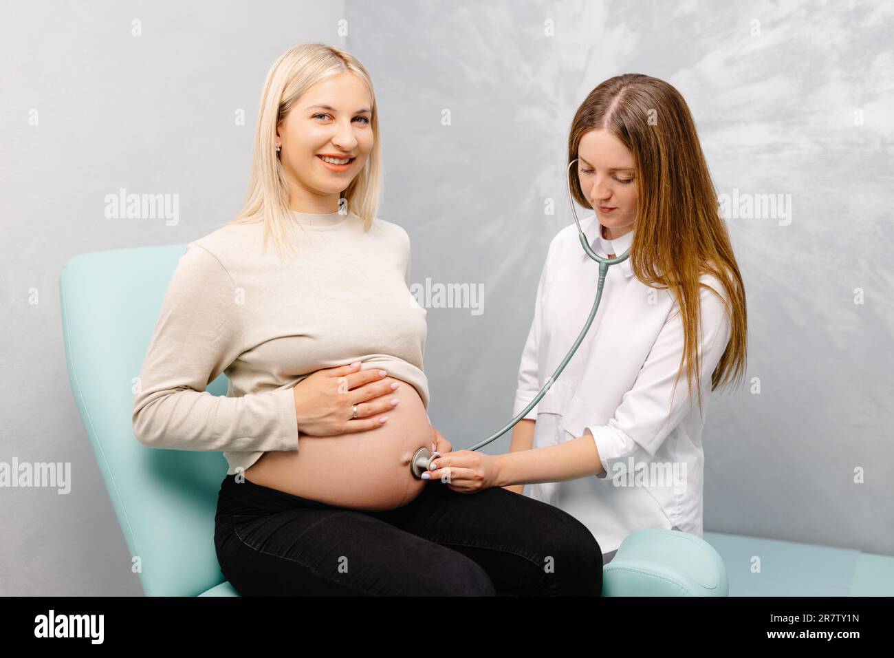 Female Doctor Using Stethoscope Examining Pregnant Woman In Clinic Medical Exam Pregnant Woman