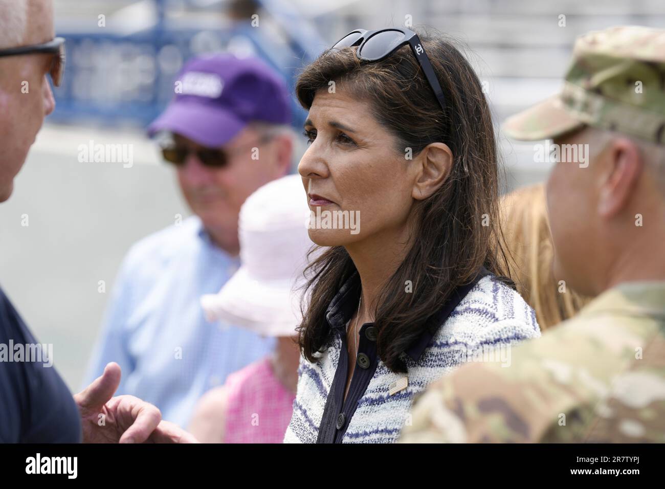 Republican presidential candidate Nikki Haley, center, stands with her ...