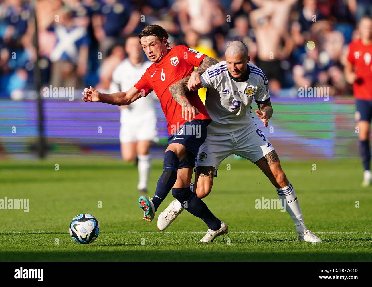 Norway's Patrick Berg (left) and Lyndon Dykes battle for the ball ...