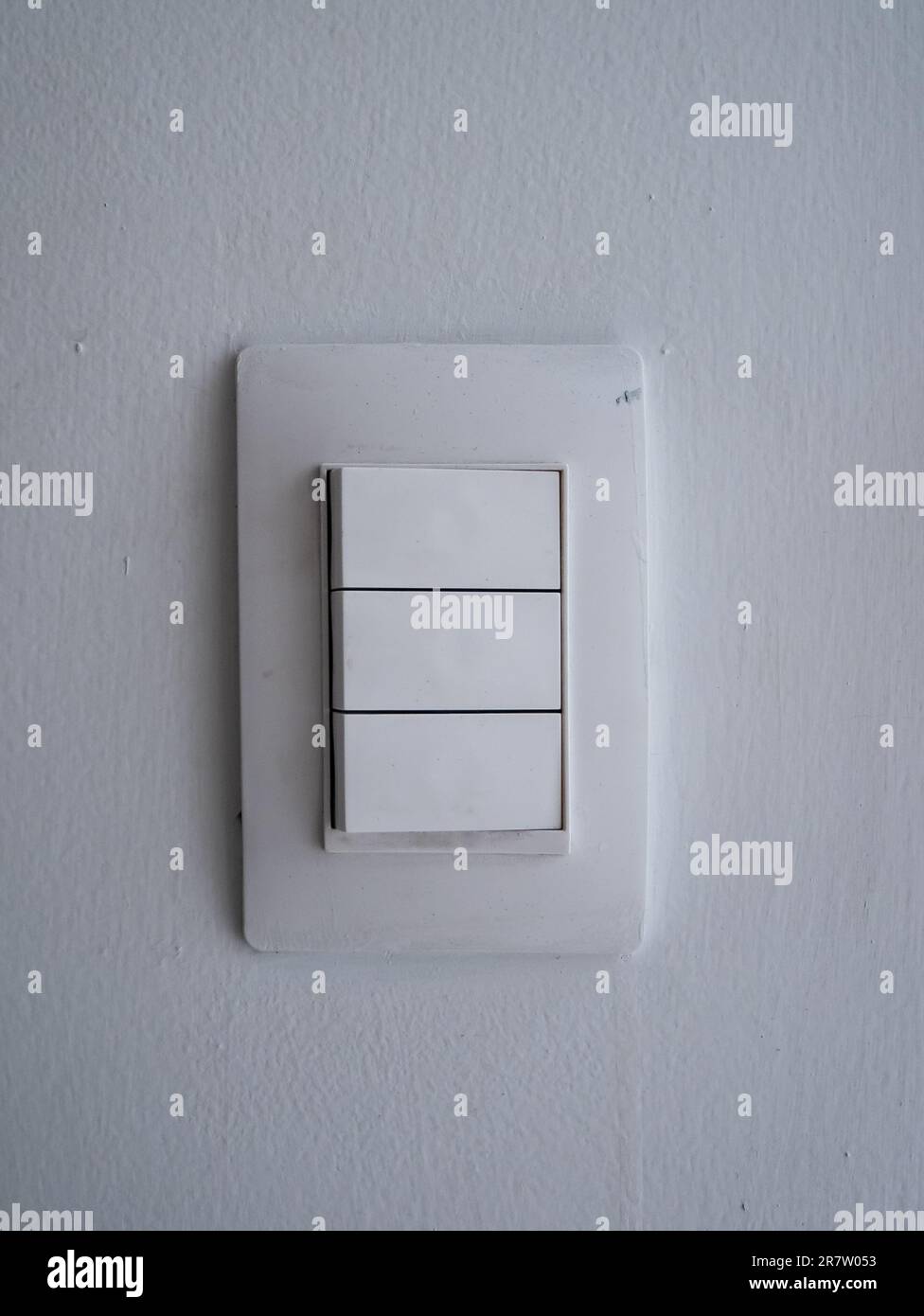 White Light Switch off on a Dirty White Wall Stock Photo - Alamy