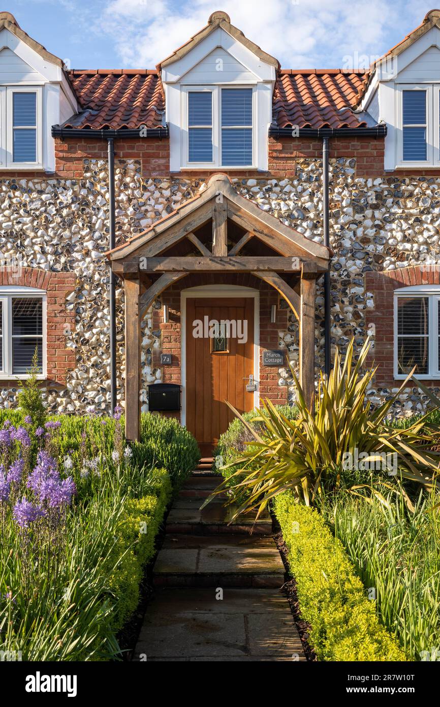 Traditional pretty brick and flint cottage with porch, dormer windows ...