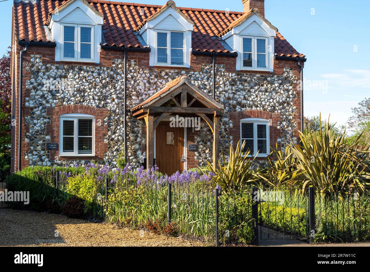 Traditional pretty brick and flint cottage with porch, dormer windows ...