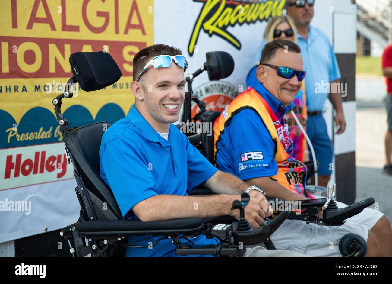 From left, Kent Madison smiles beside world champion drag racer Darrell ...