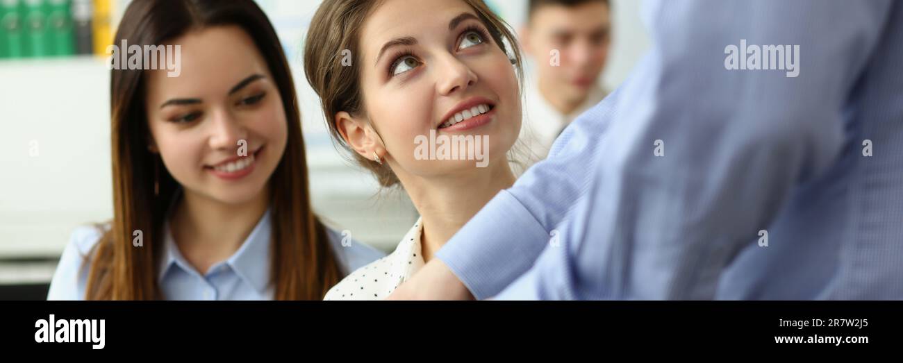 Boss or coach mentor coach showing young female trainee document on ...