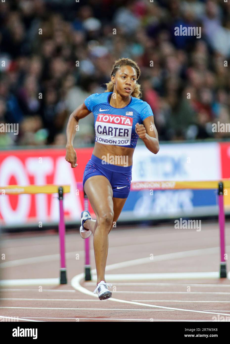 Kori Carter participating in the 400 meters hurdles at the World ...