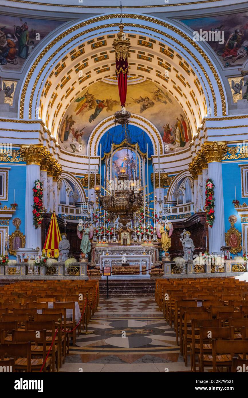 The interior of the Mosta Rotunda decorated with religious icons in ...