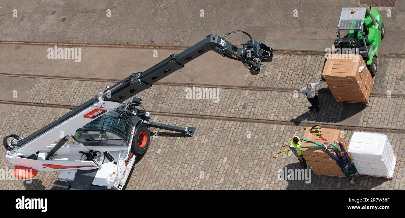 Le Havre, France, Mobile crane lifting goods and loading ships supplies ...