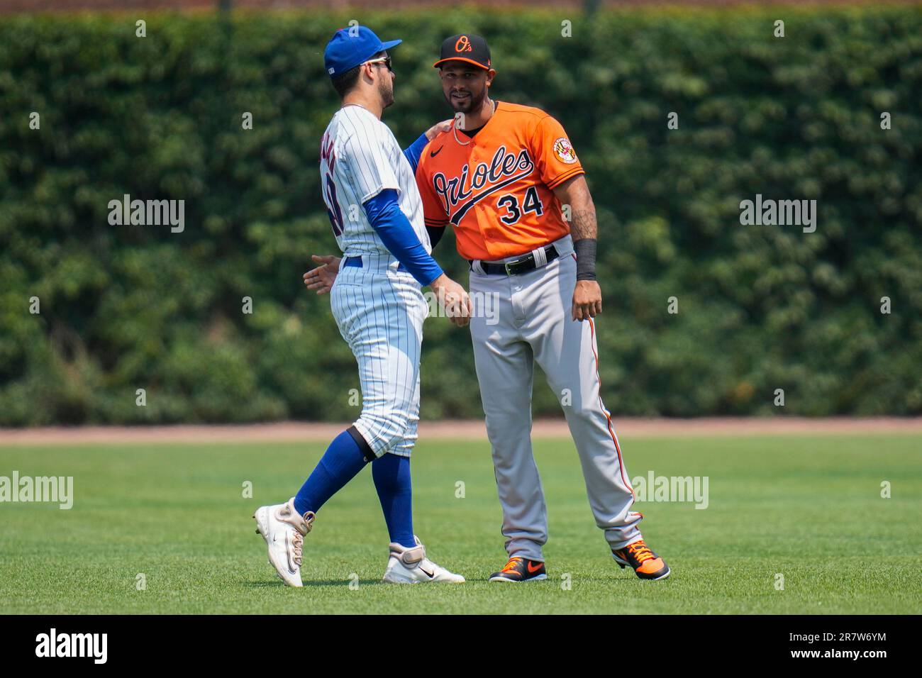 Chicago Cubs' Mike Tauchman, left, and Baltimore Orioles' Aaron Hicks ...