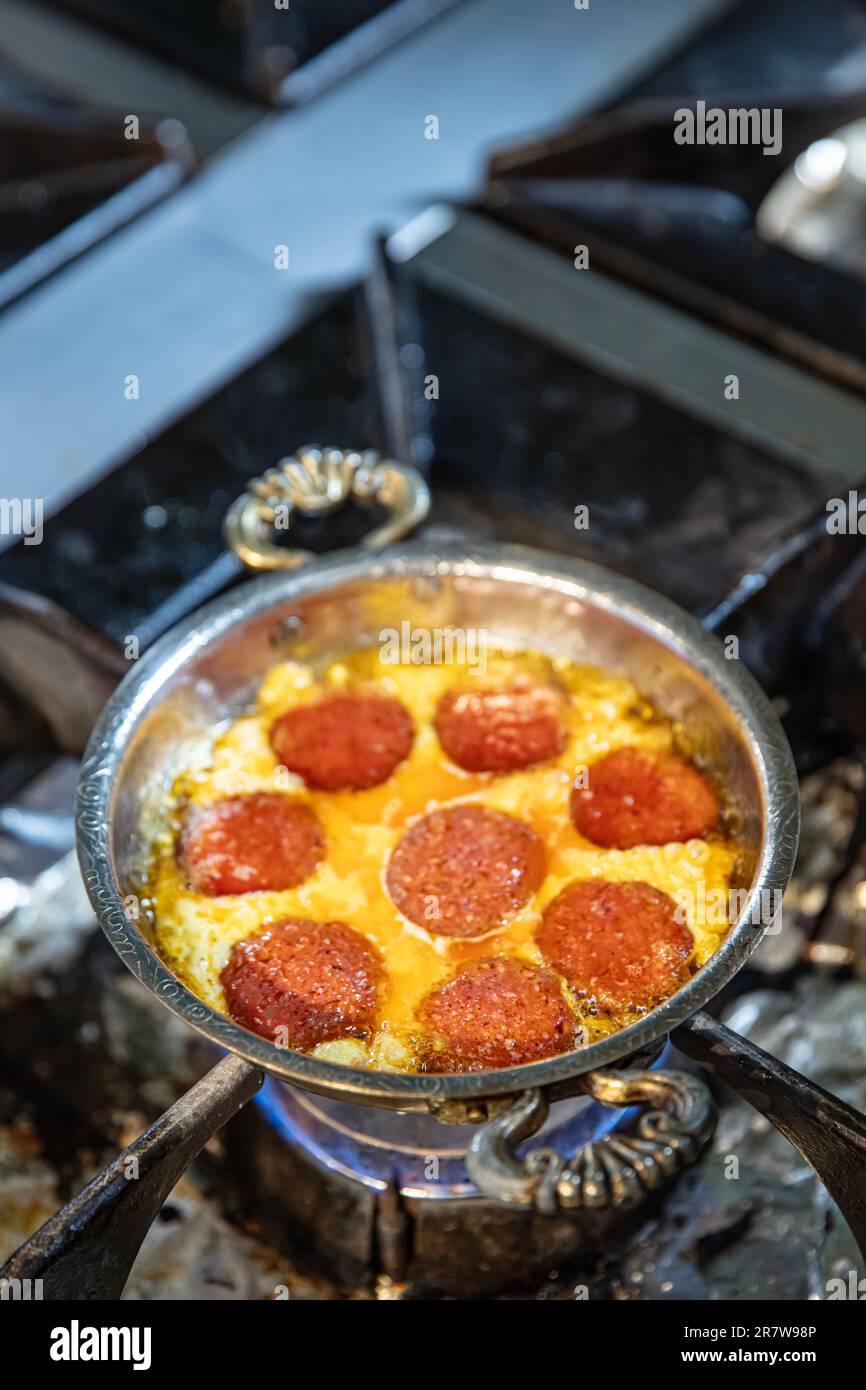 Turkish fried egg made by sausage (sucuk), eggs, spices. Appetizing ...