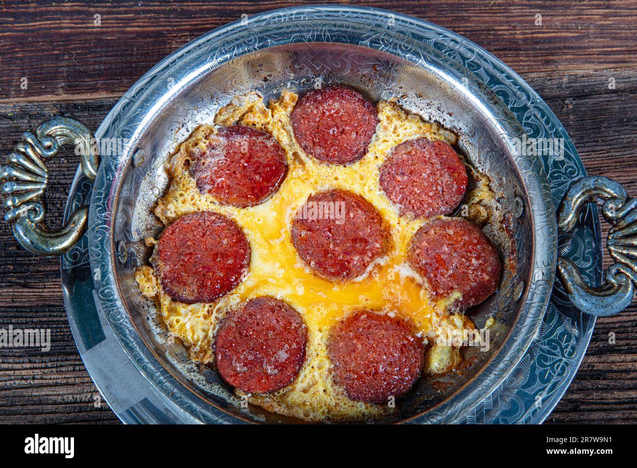 Turkish fried egg made by sausage (sucuk), eggs, spices. Appetizing ...