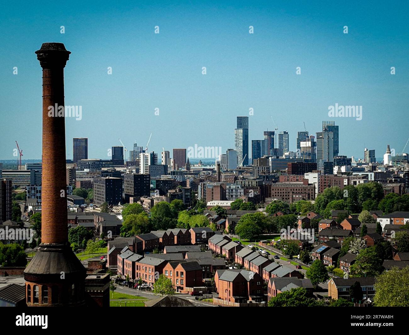 Ancoats Cotton Mill Chimney Stack and Modern Manchester Stock Photo - Alamy