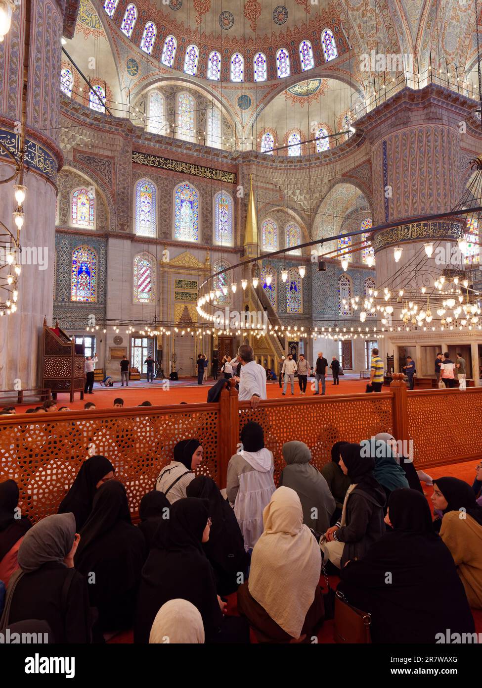 School children sat down inside the Blue Mosque aka Sultan Ahmed Mosque ...
