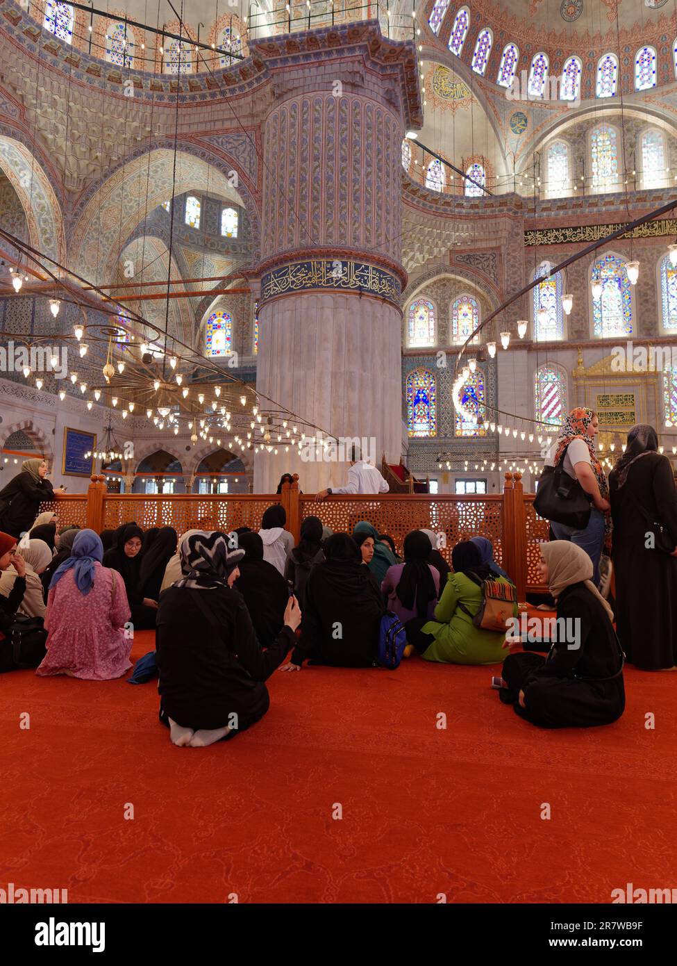 School children sat down inside the Blue Mosque aka Sultan Ahmed Mosque ...