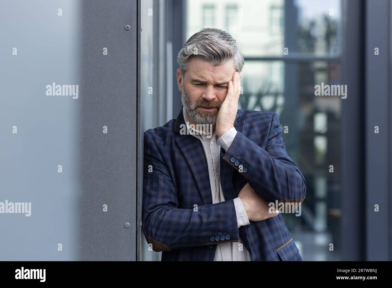 Mature boss sick, man has severe headache, businessman in business suit ...