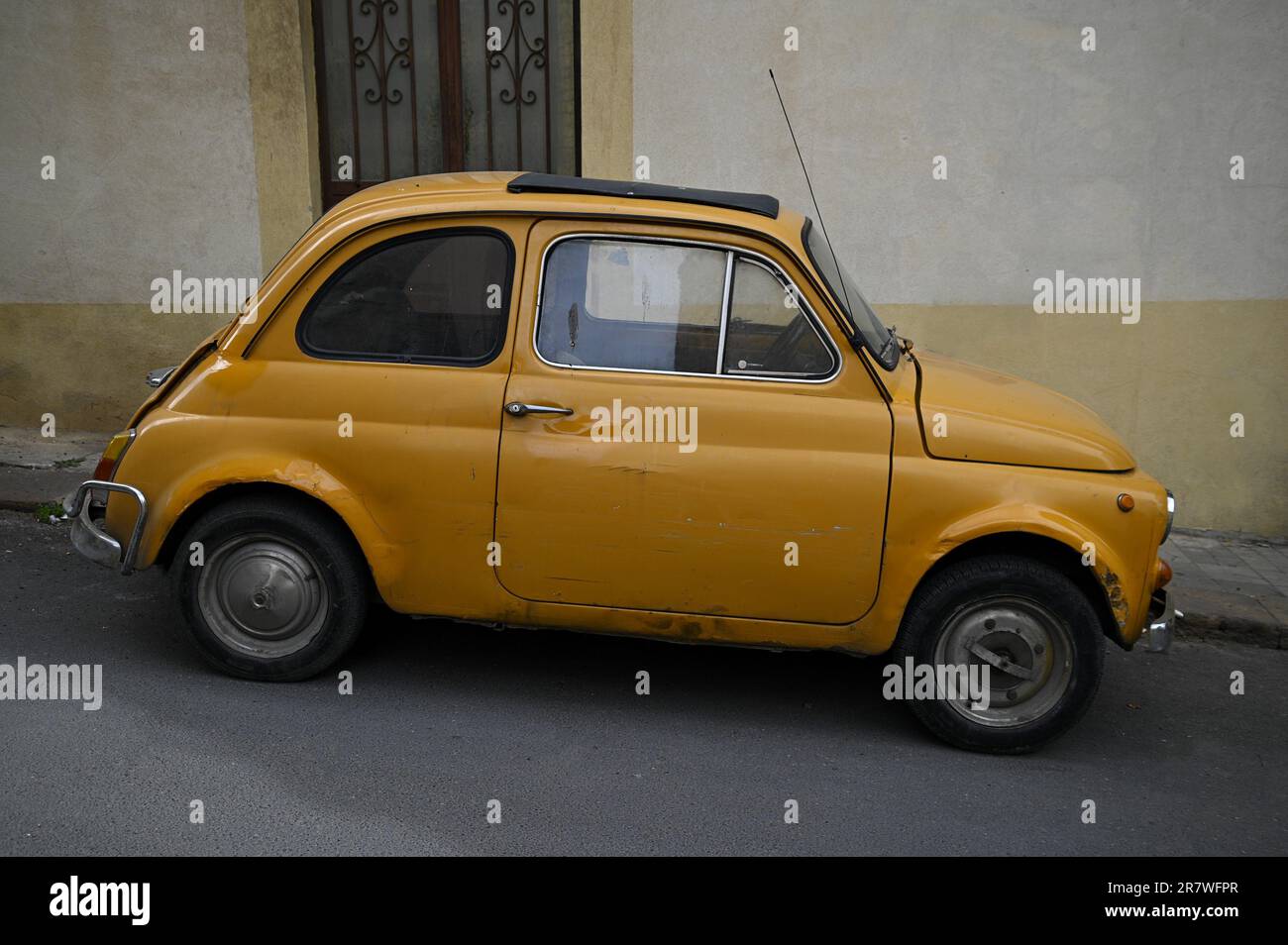 Vintage semi-convertible Fiat 500 Cinquecento on Via Cavour in Piazza ...