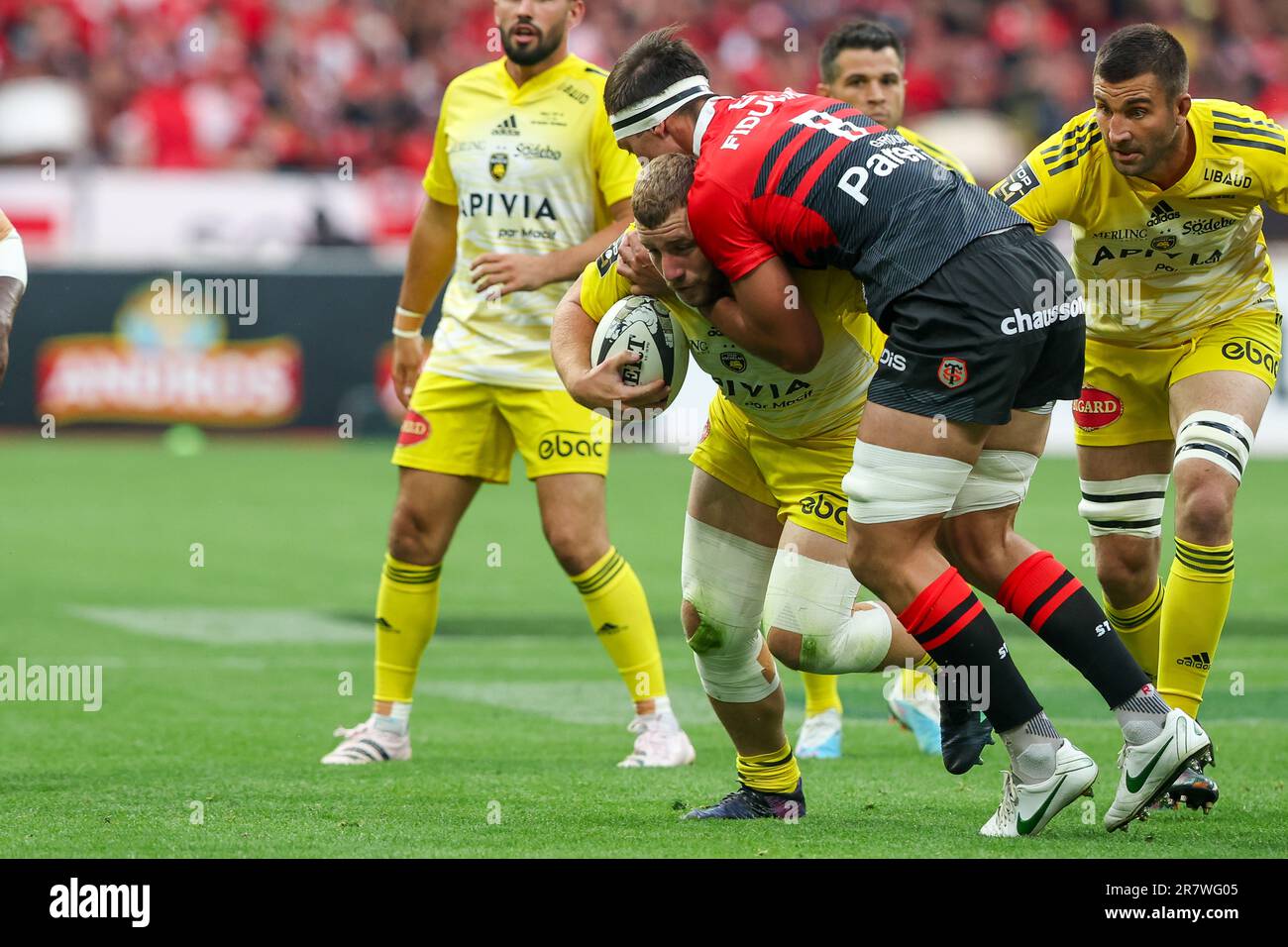 PARIS, FRANCE - JUNE 17: Pierre Bourgarit of Stade Rochelais is tackled ...