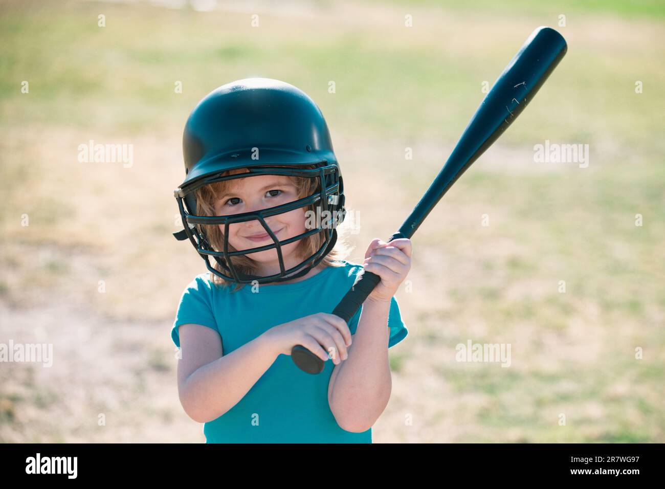 Baseball kid players in helmet and baseball bat in action Stock Photo ...