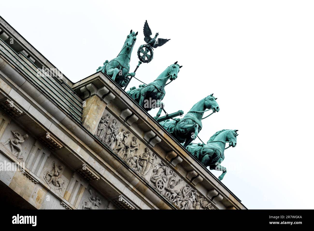 An array of ornate statues perched atop a grandiose structure ...