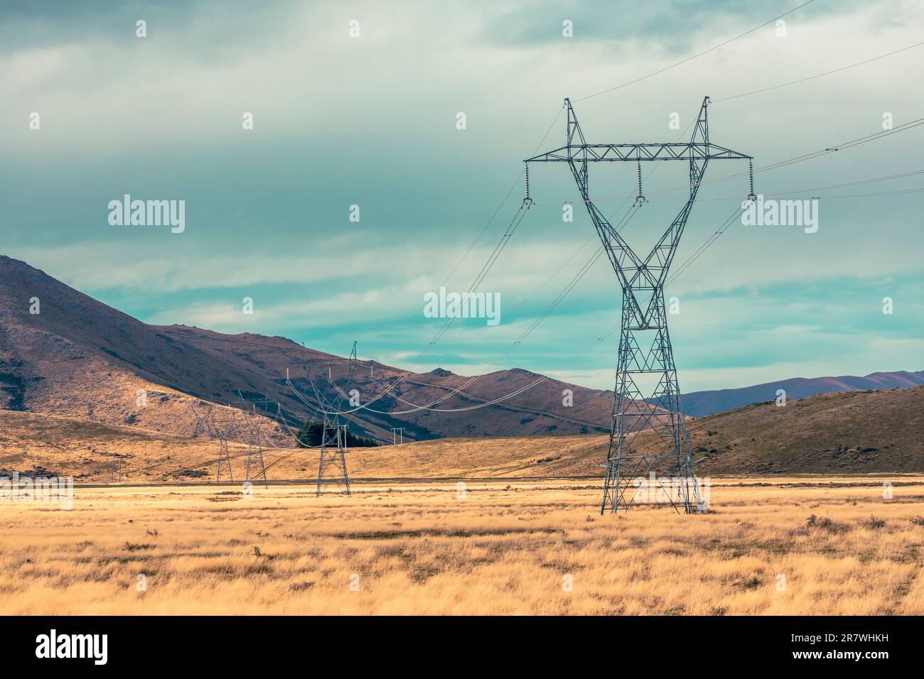 Photograph of large transmission towers and lines running through a ...