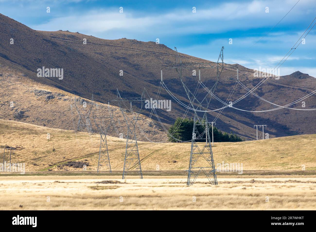 Photograph of large transmission towers and lines running through a ...