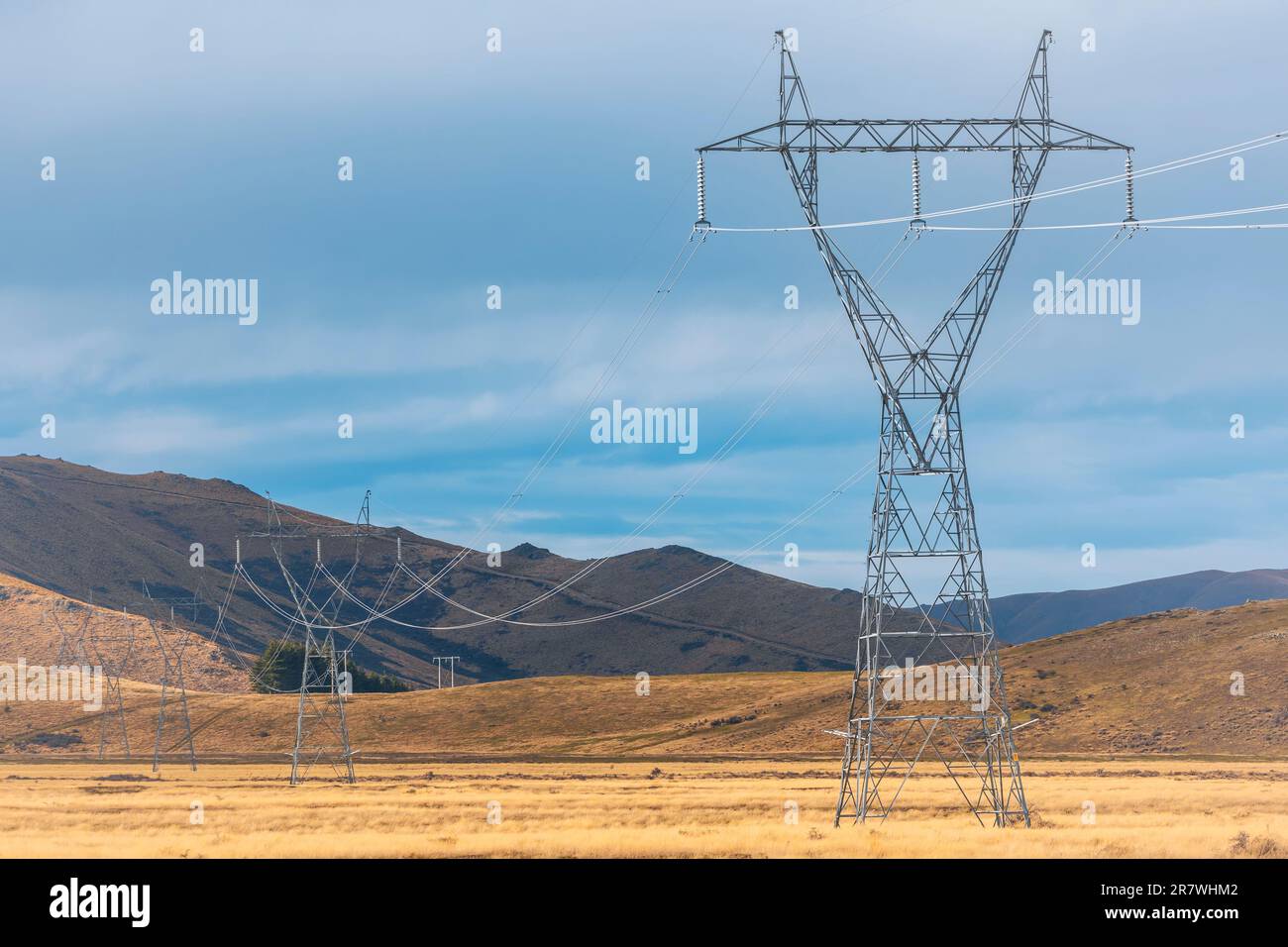 Photograph of large transmission towers and lines running through a ...