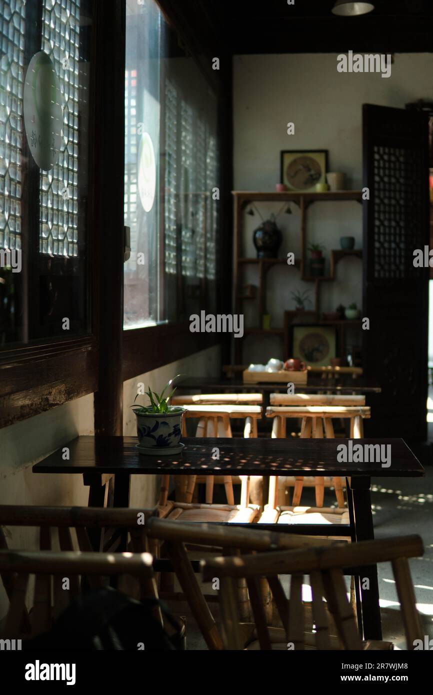 A modern restaurant interior featuring bright, natural light streaming ...