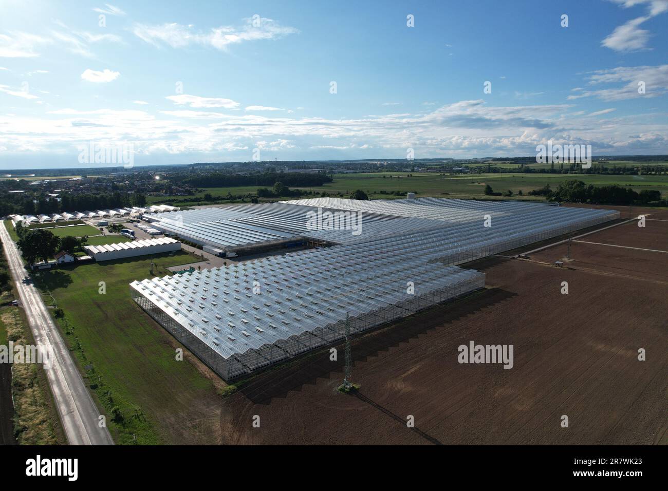 Glass greenhouses from above in sunny weather, big glass houses from ...