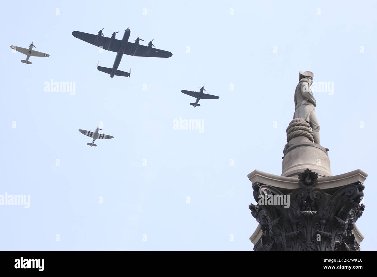 A Lancaster bomber flanked by Spitfire and Hurricane planes is seen ...