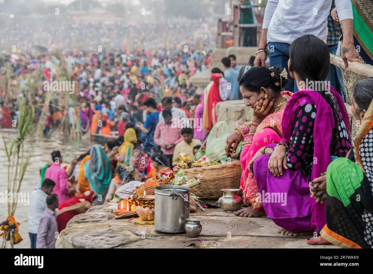 Devotees make offerings and pray in the Ganges during Chhath Puja in ...