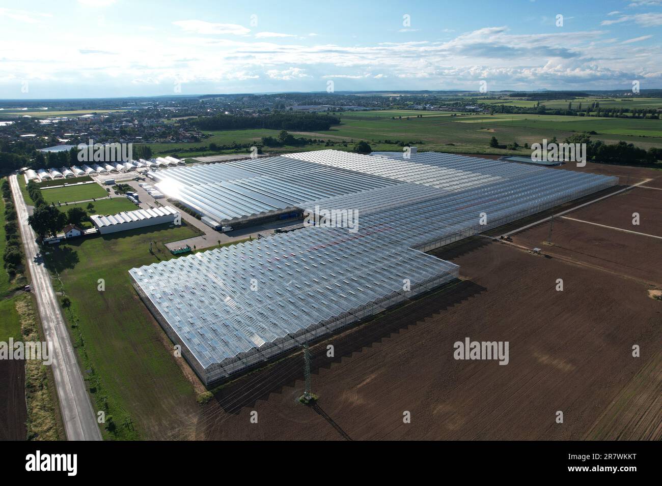 Glass greenhouses from above in sunny weather, big glass houses from ...