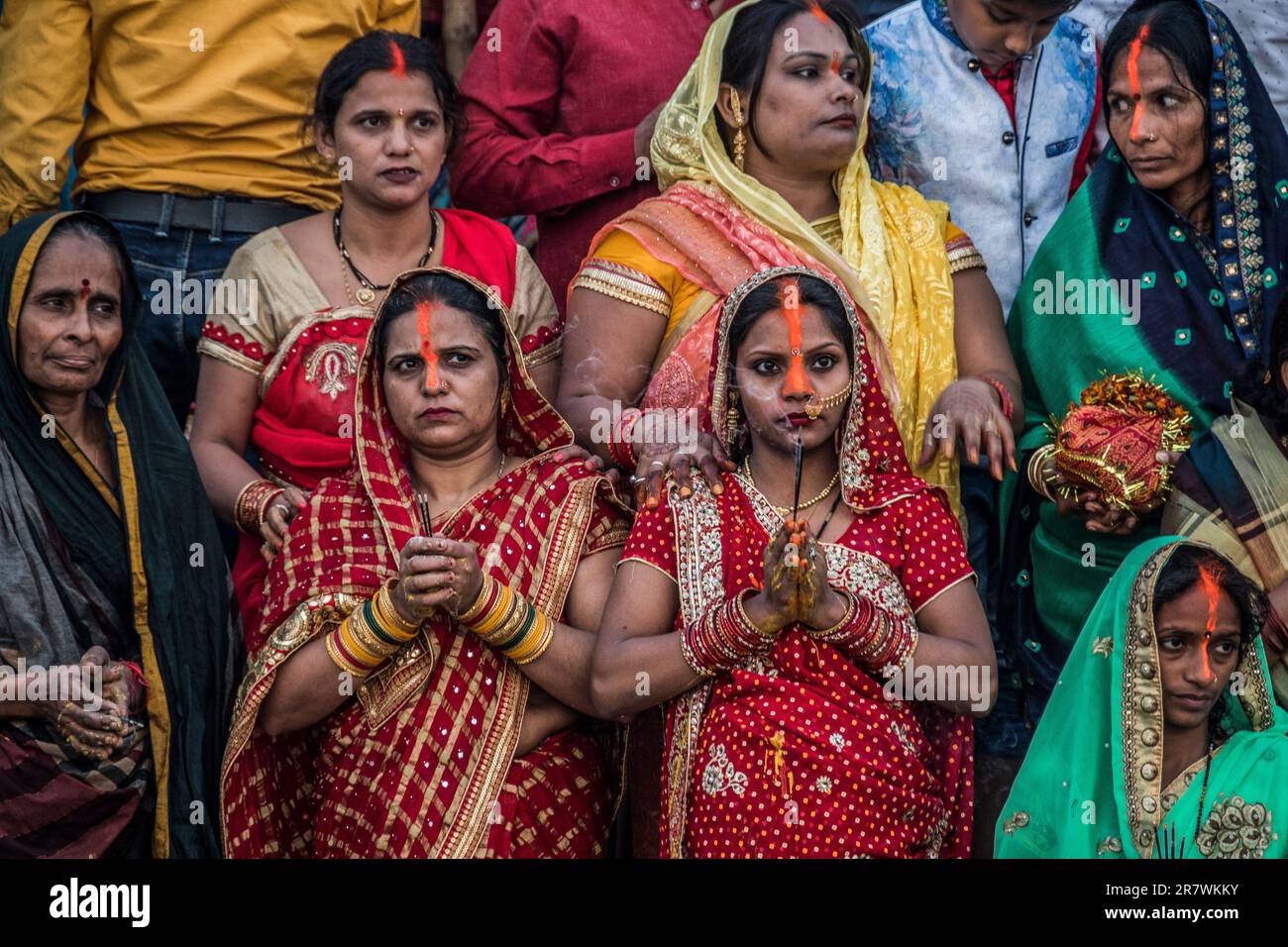 Devotees make offerings and pray in the Ganges during Chhath Puja in ...