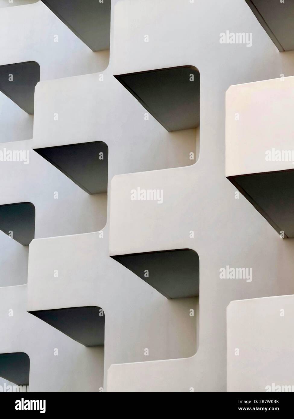 A modern building exterior with a series of geometric architectural ...