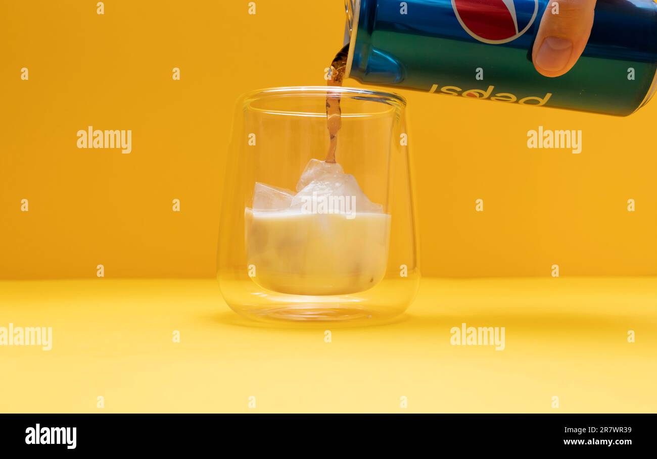 Someone cook Pilk, Trendy Pepsi Milk Drink. Person Combining soda and ...