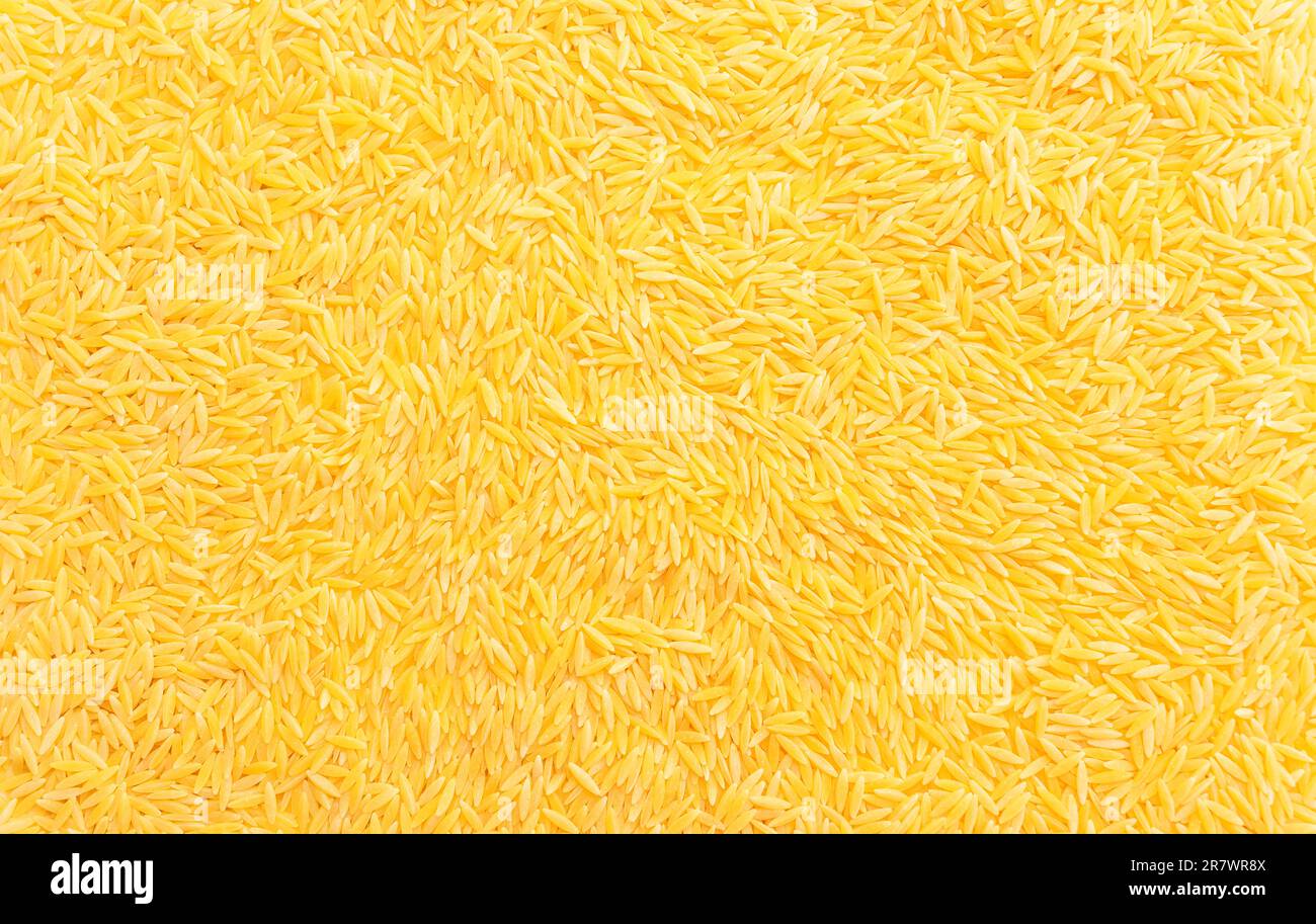 Background texture of dried risoni, orzo pasta. Italian cuisine. Durum ...