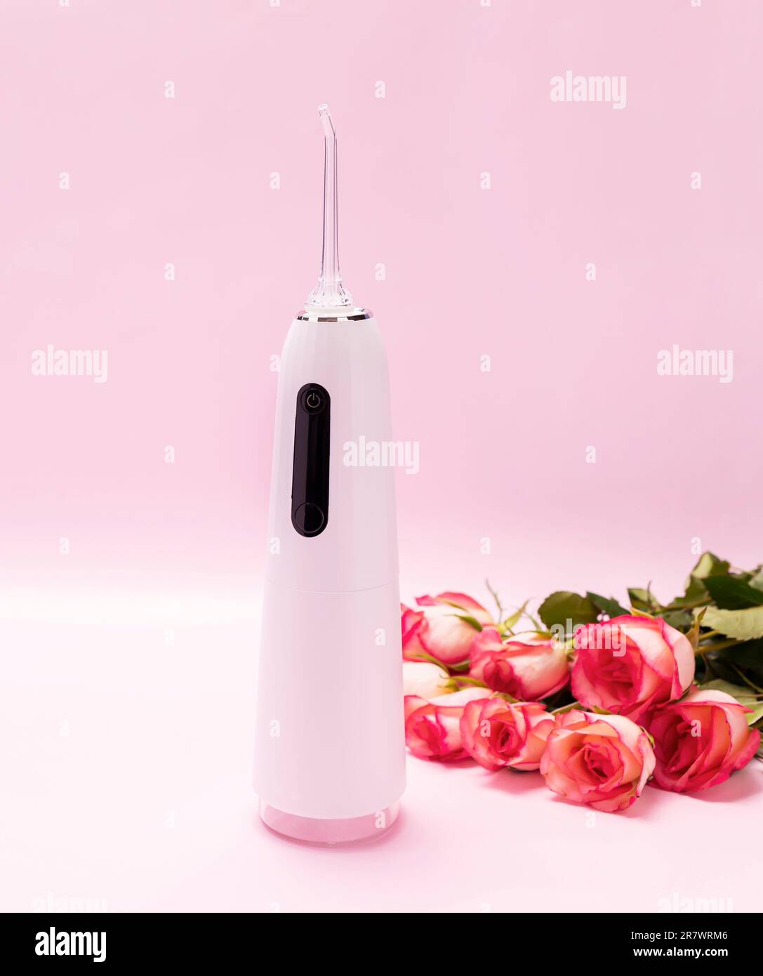 Dental discount, sale. holiday concept. Oral teeth irrigator, roses on ...